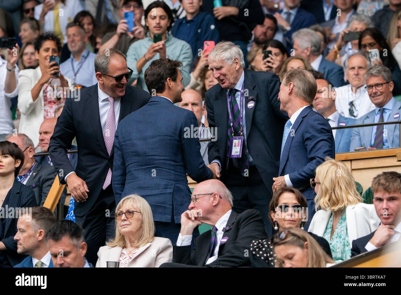 LONDON, UNITED KINGDOM - JULY 7: Roger Federer interacts with Tim ...