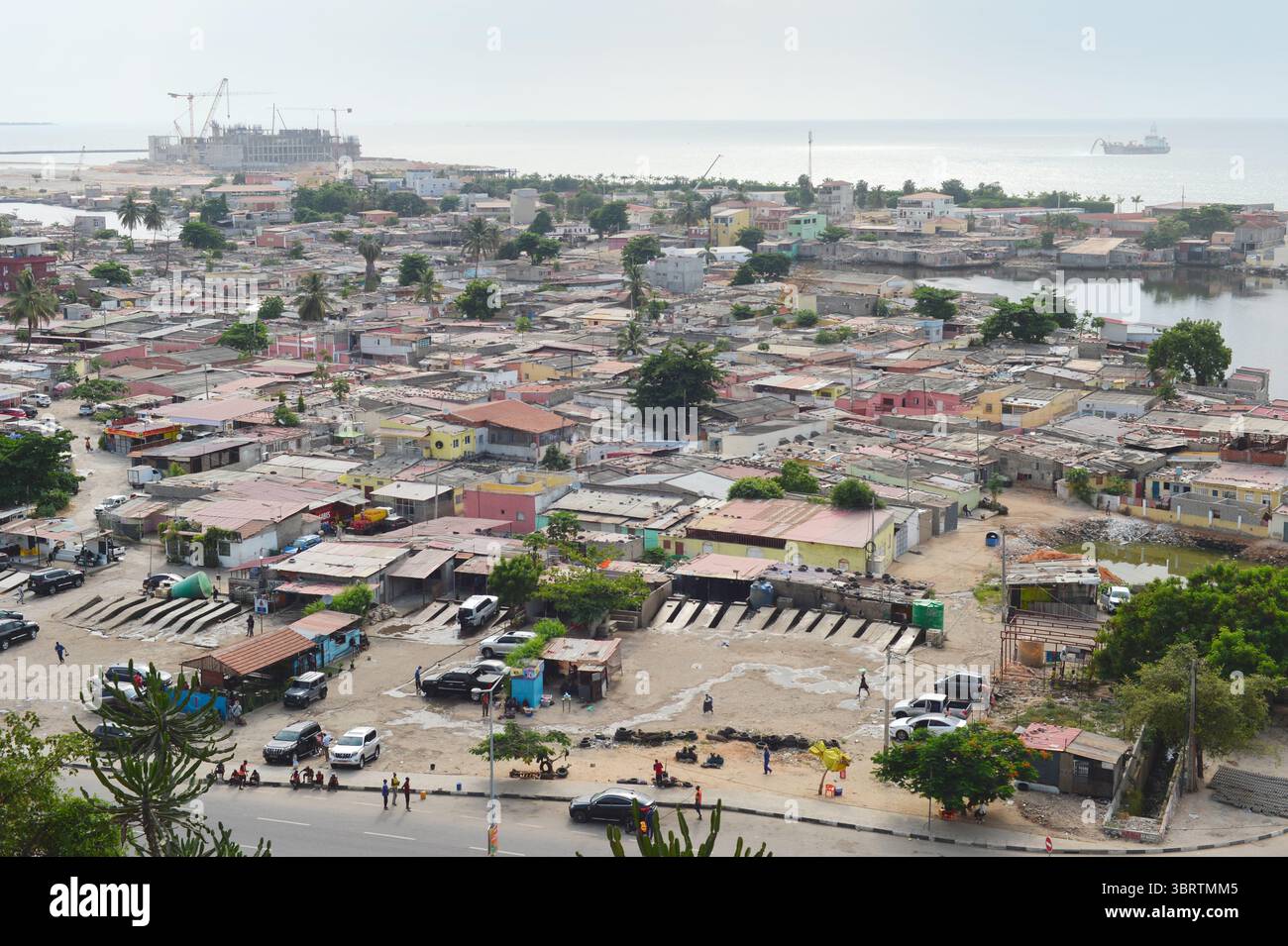 LUANDA, ANGOLA - FEB 06, 2025: Aerial view of a slum in front of the ...