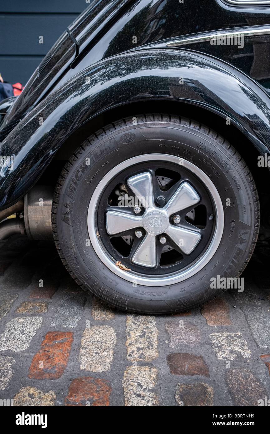 Close-up of a wheel, Volkswagen beetle and a Porsche Embleton on the ...