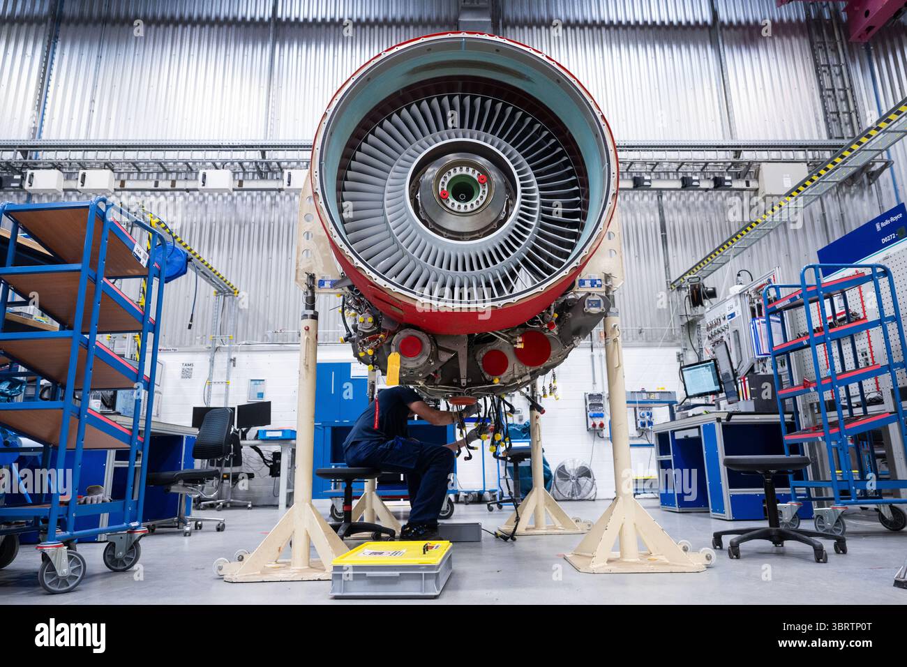 Blankenfelde Mahlow, Germany. 14th July, 2025. An employee works on an ...
