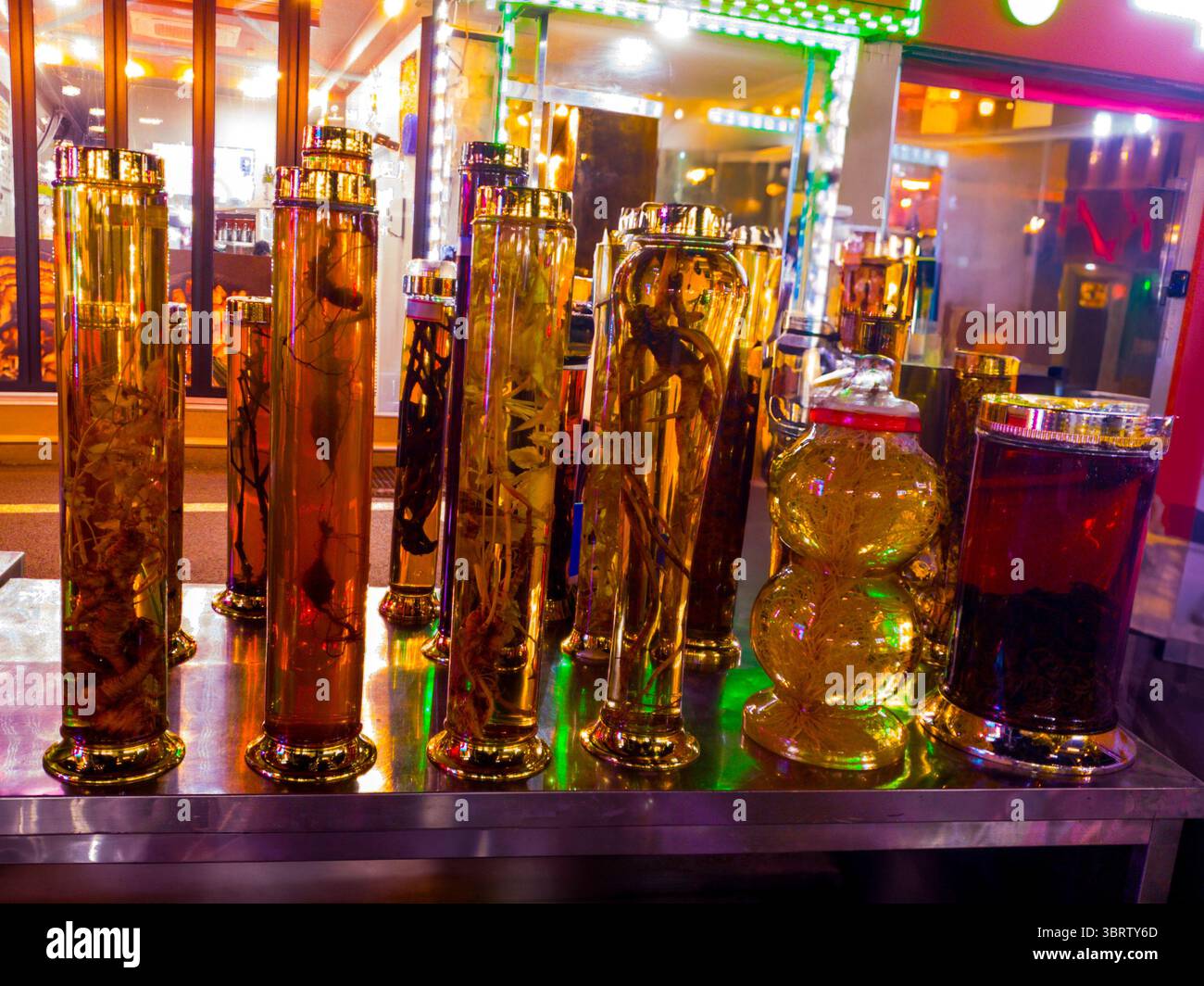 Ginseng in a bottle. Ginseng from Korea mixed with soju water in a ...