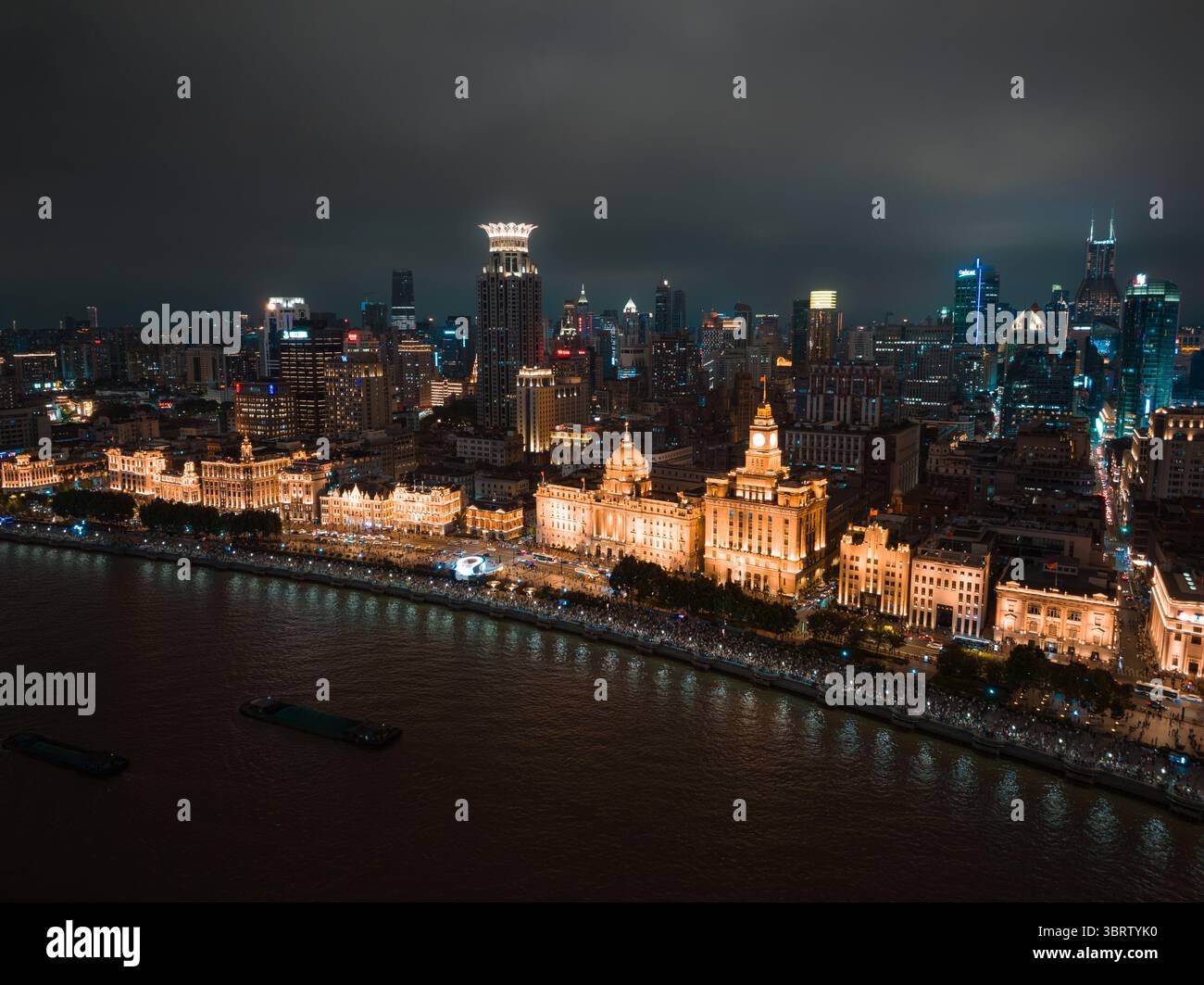 Shanghai, China - 21 June 2025: Aerial view of Shanghai's glowing Bund ...