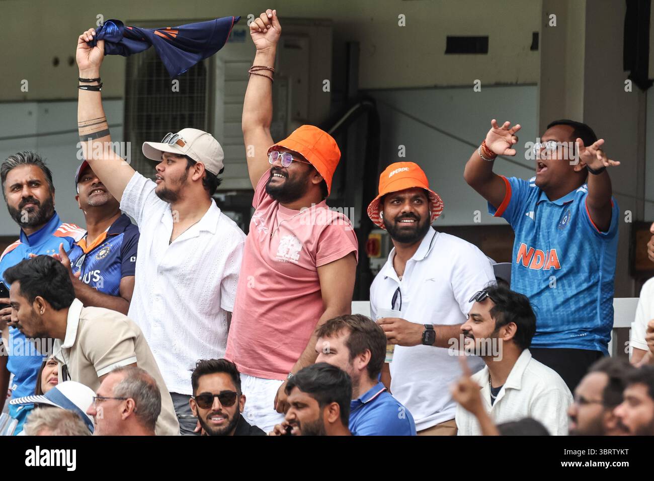 India fans celebrate a boundary four off Nitish Kumar Reddy of India ...