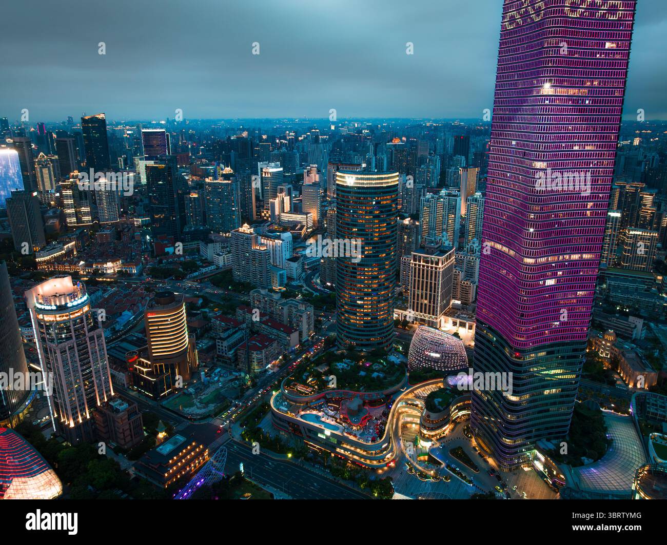 Shanghai, China - 21 June 2025: Aerial view of a vibrant cityscape ...