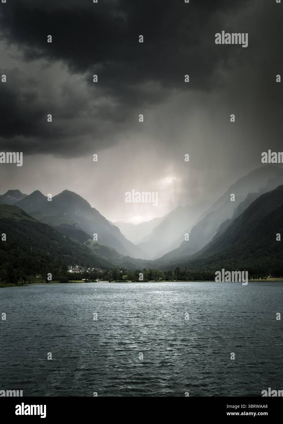 Dark storm clouds and rain gather over the Genos-Loudenvielle lake in ...