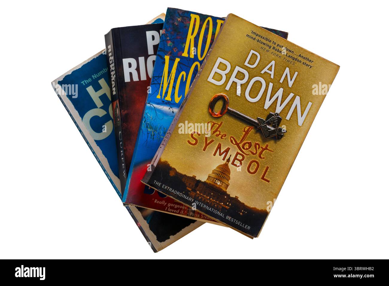 Selection of books with The Lost Symbol book by Dan Brown on top ...