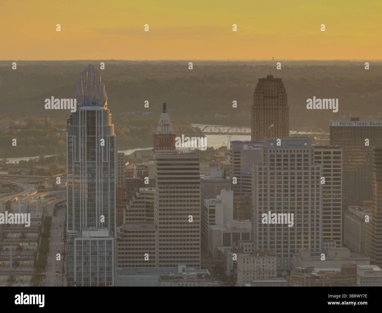 Aerial view of skyscrapers pierce the twilight sky, their silhouettes ...