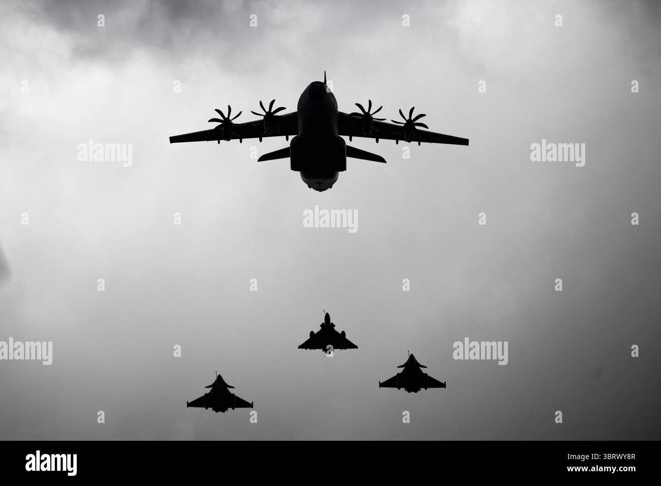 Rafale fighter jets, an A400M aircraft fly over the Champs-Elysees ...