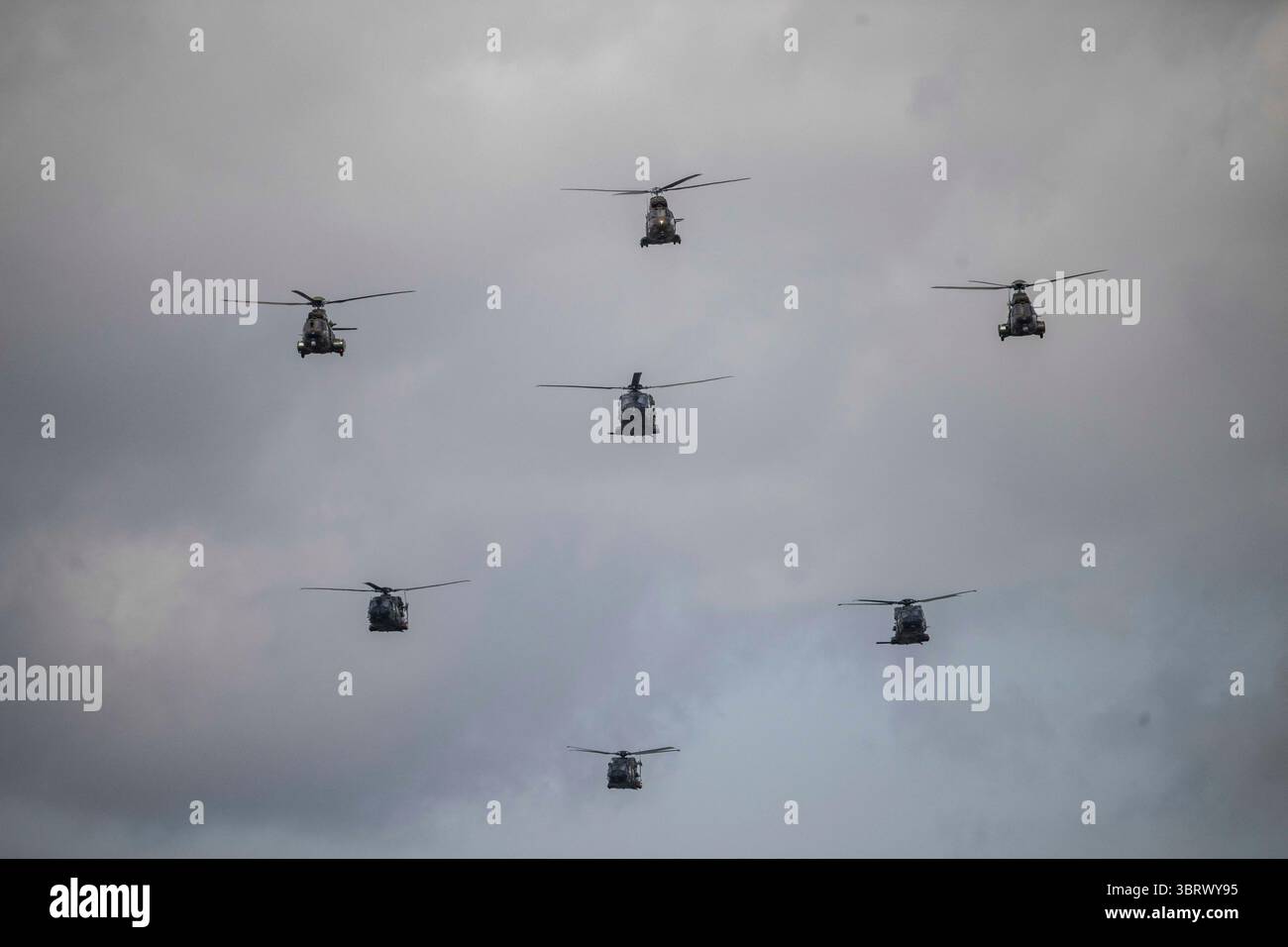 French Air and Space Army helicopters perform a fly-over during the ...