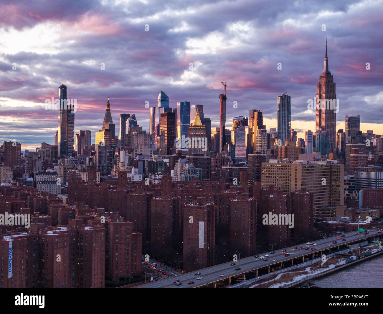 Aerial view of the Empire State Building piercing the skyline ...