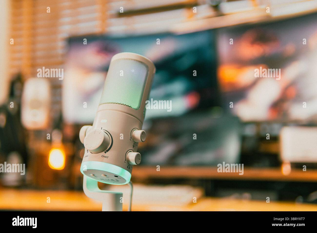 Modern cinematic desk setup with triple monitor, gaming chair, ambient light, and cozy ...