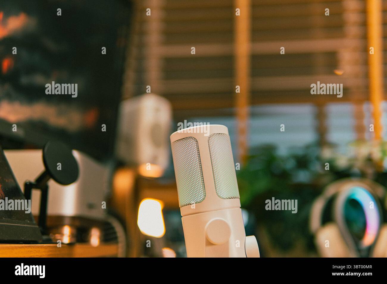 Modern cinematic desk setup with triple monitor, gaming chair, ambient light, and cozy ...