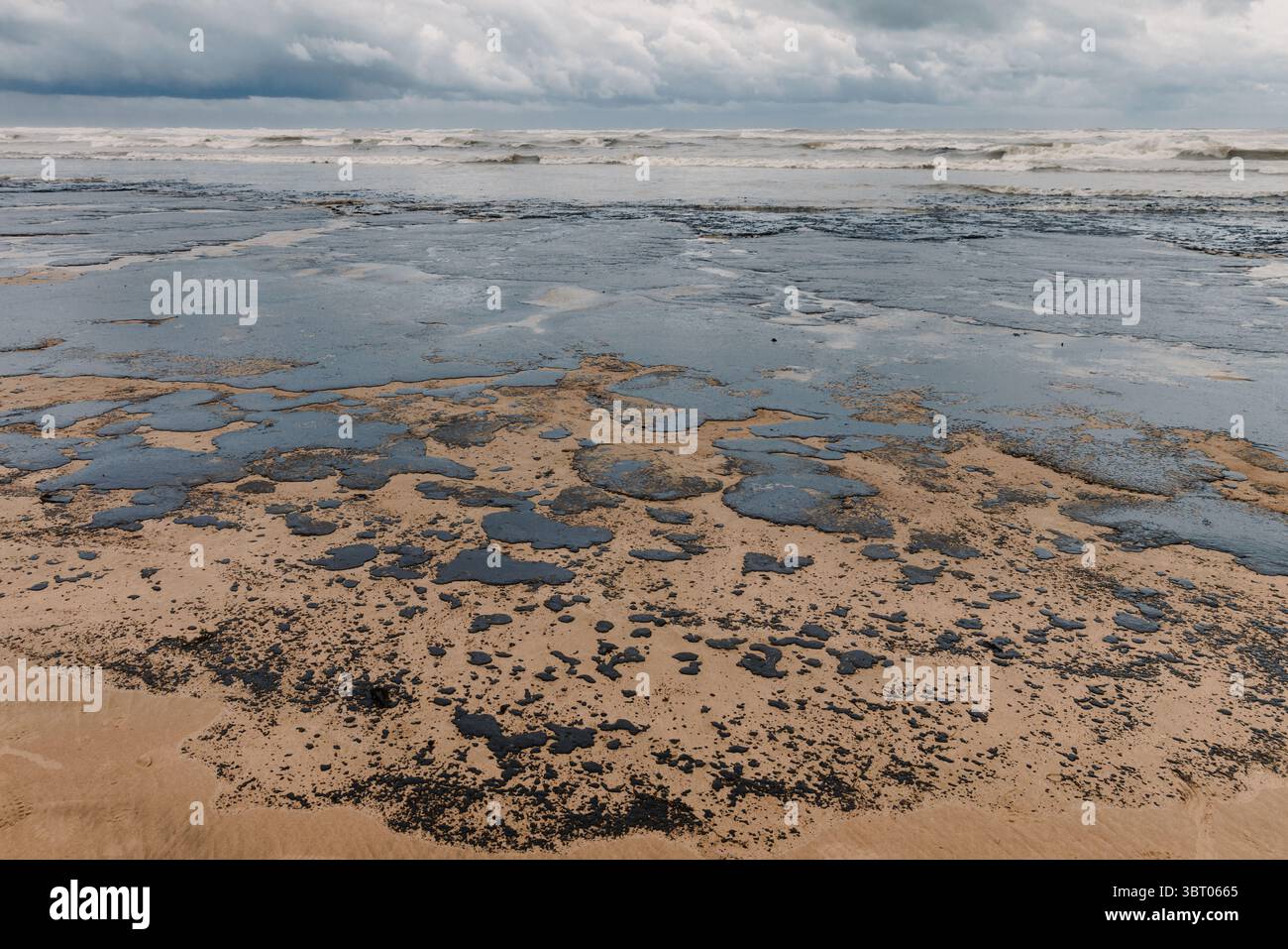 Oil spill contaminates beach shoreline, showing the environmental ...