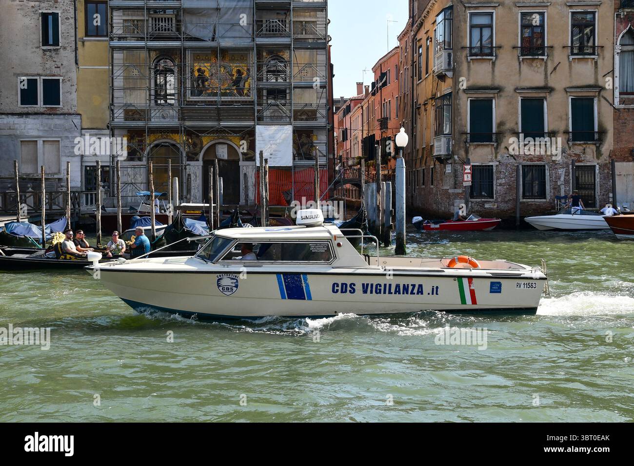 A vigilance boat passing on the Grand Canal, in front of Palazzo ...