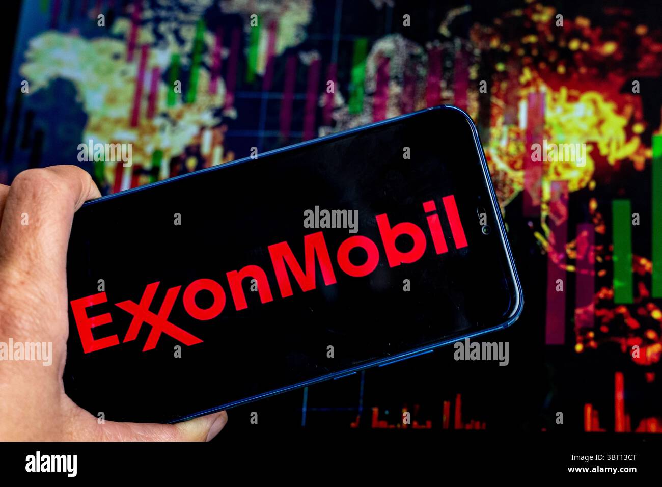 UK. 13th July, 2025. In this photo illustration, the Exxon Mobil logo ...