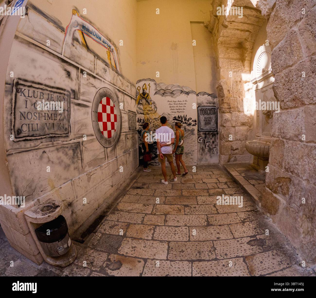 Split, Croatia - September 8th 2023: Tourists admire the street art in ...