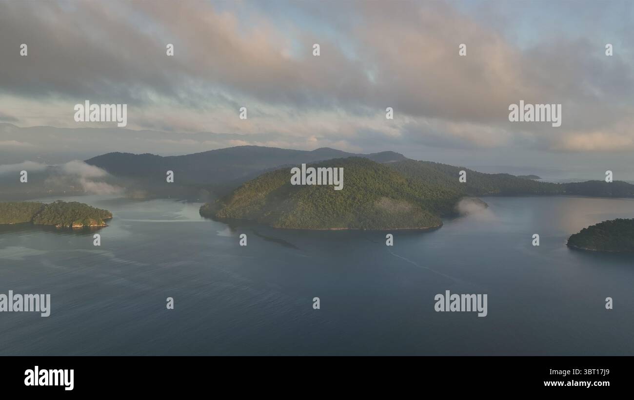 Aerial view of islands cloaked in mist, where emerald forests meet the ...