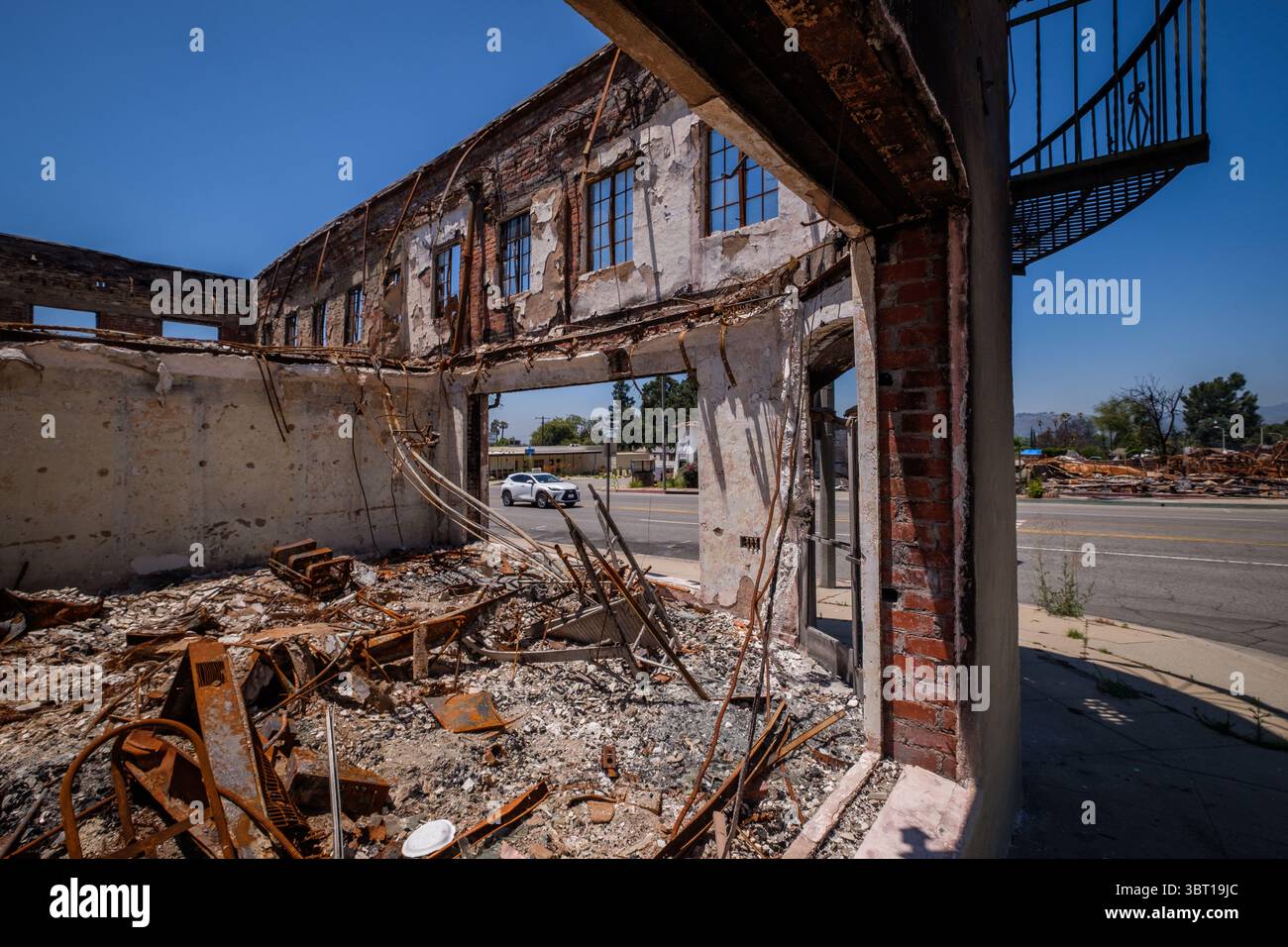 Remains of a burned out building on Lake Avenue in Altadena, California ...