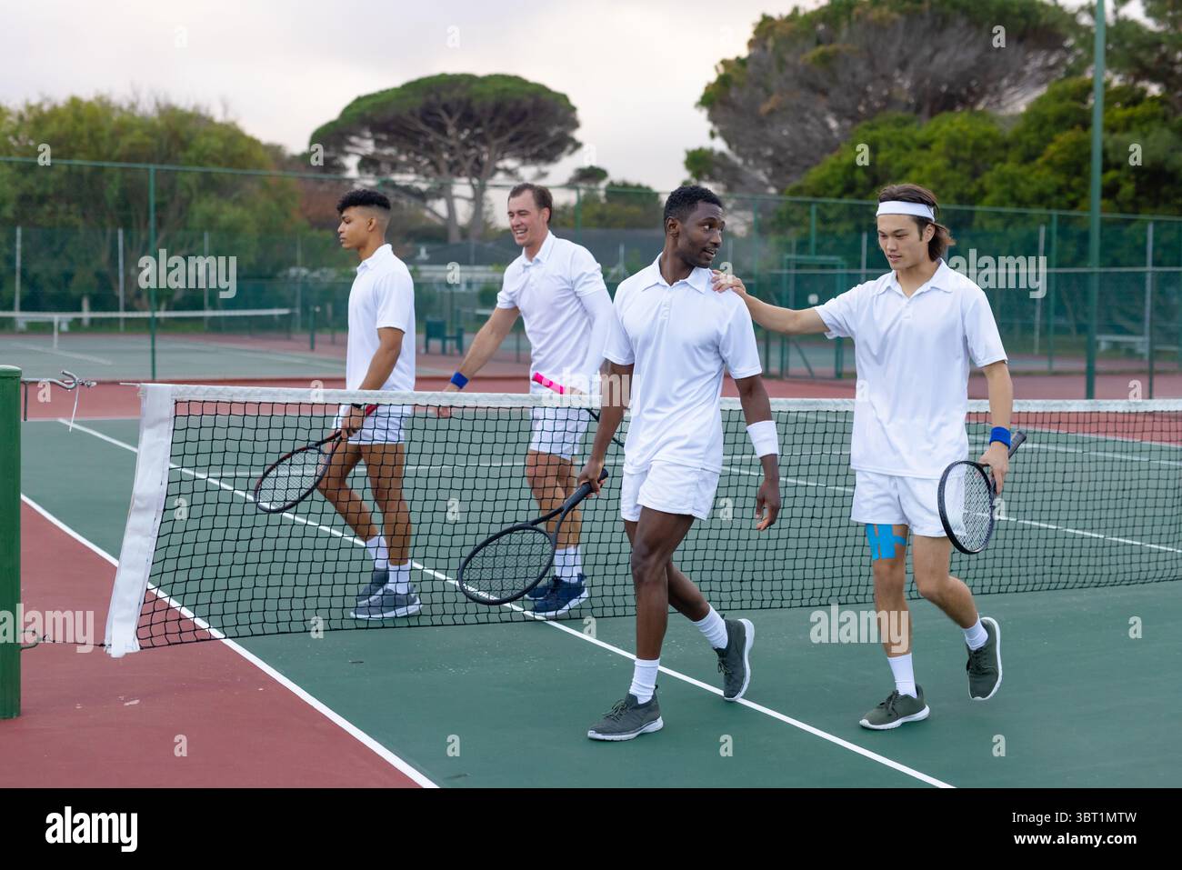 Diverse male tennis players exchanging hi-res stock photography and ...