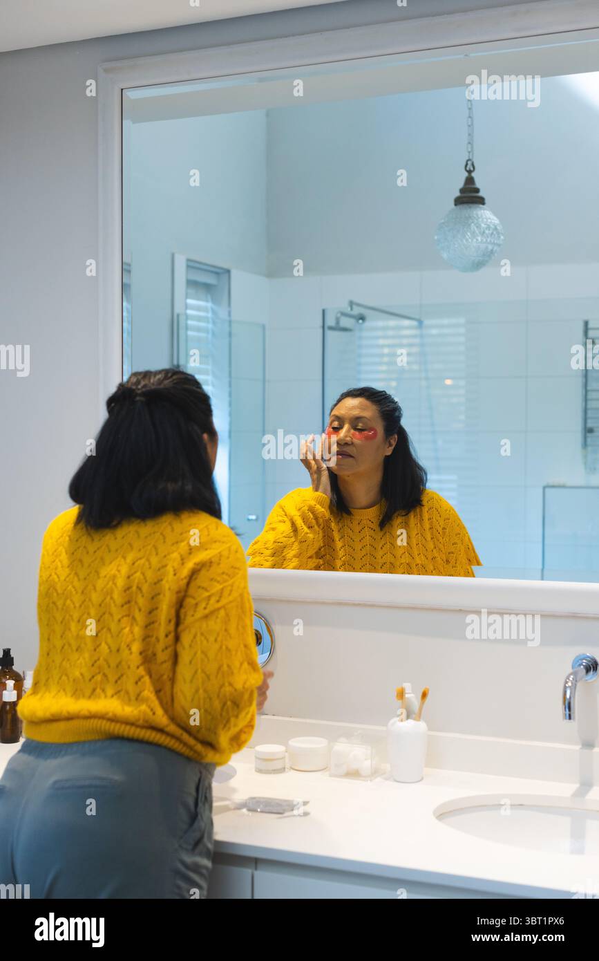 Woman adjusting facial patches hi-res stock photography and images - Alamy
