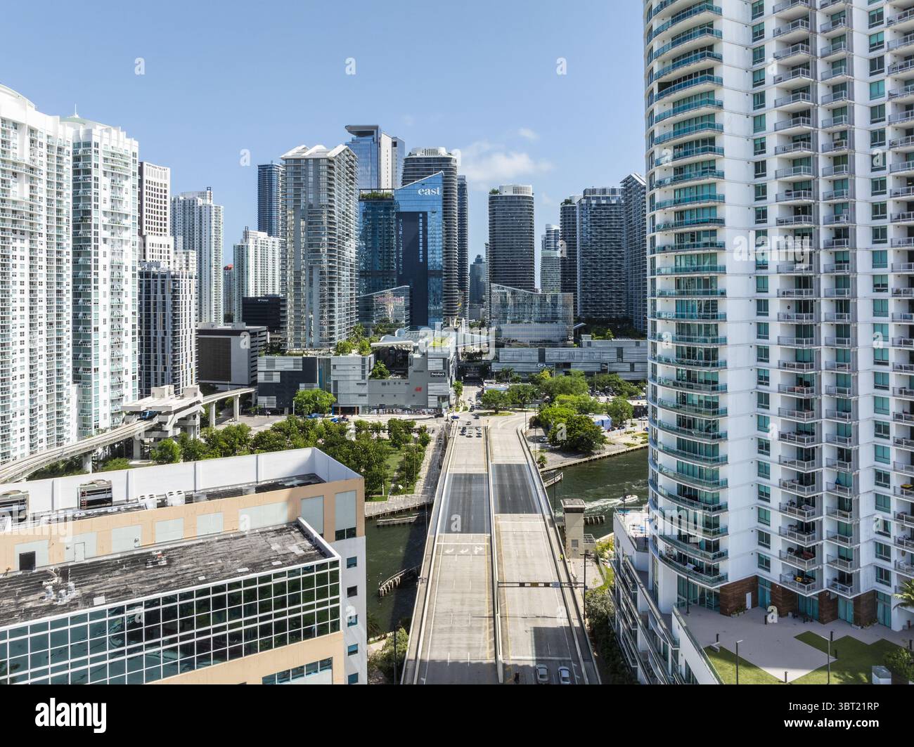 Aerial view of the vibrant cityscape where modern skyscrapers meet lush ...
