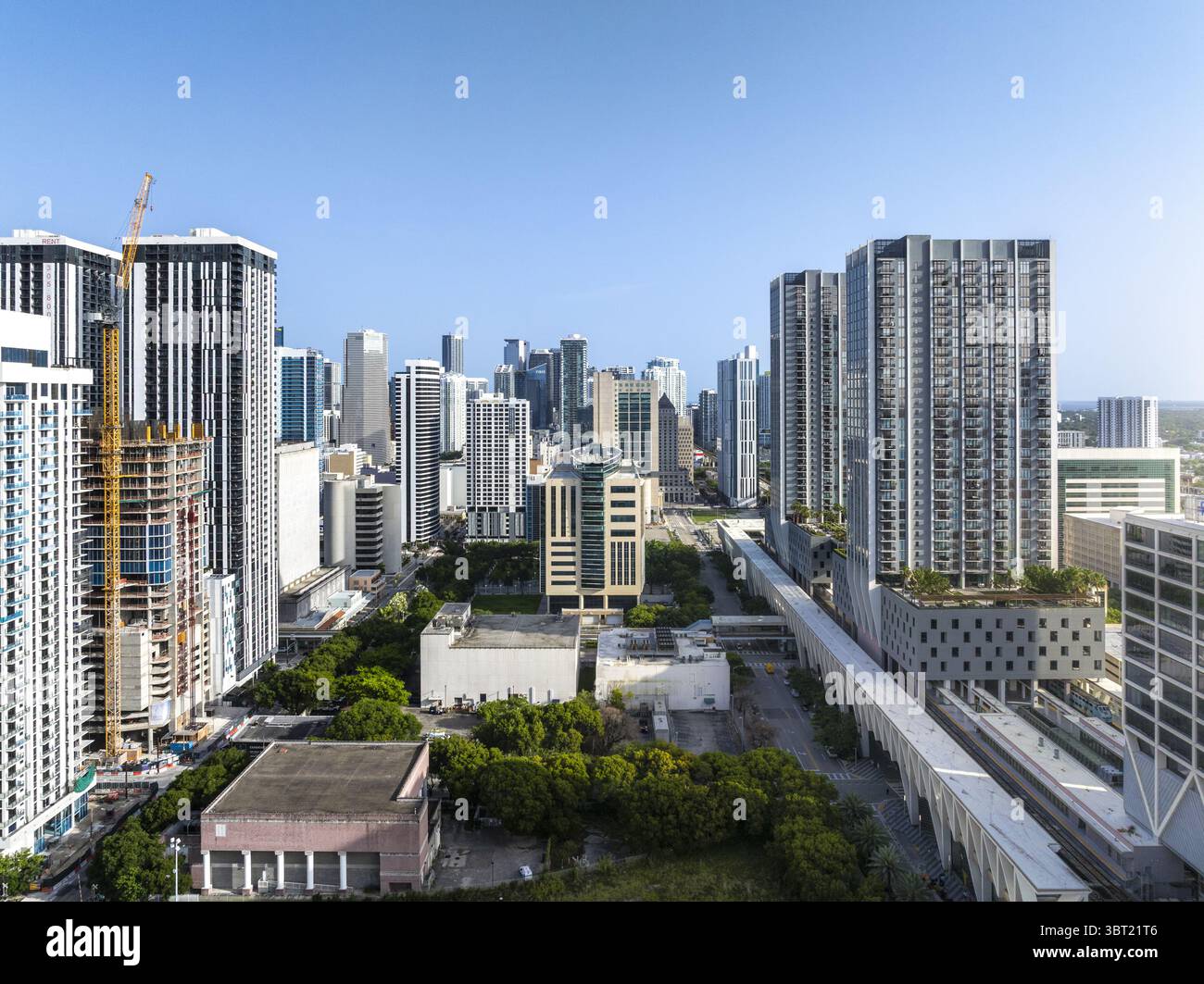 Aerial view of gleaming skyscrapers piercing the azure sky, a symphony ...
