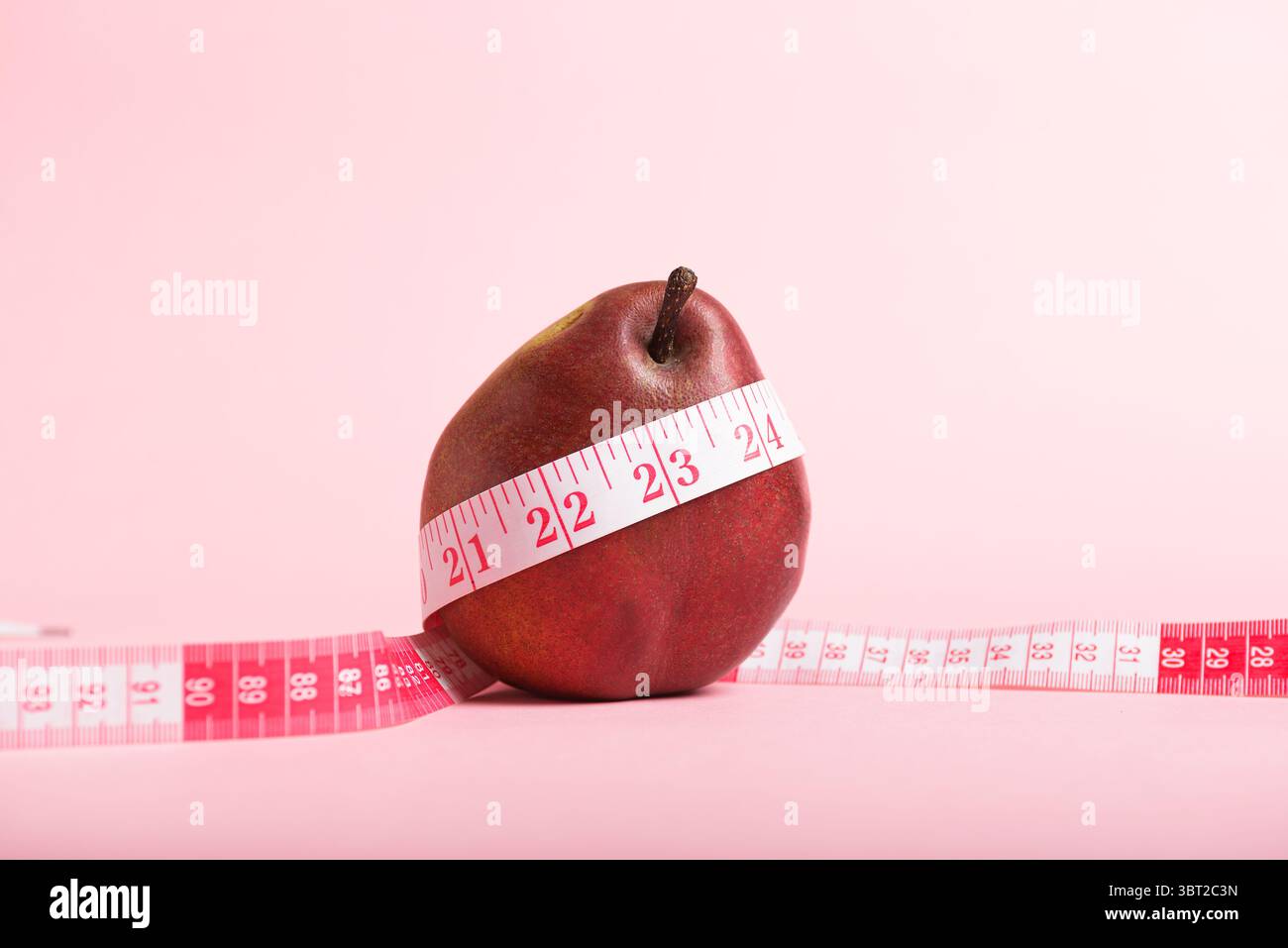 Red Pear and Measuring Tape: A Visual Metaphor for Healthy Eating Stock ...