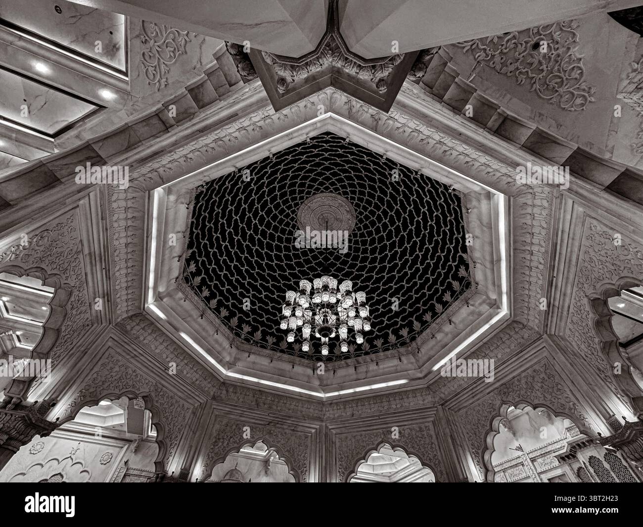 Mosque interior showcasing Islamic geometric art, chandelier, and ...