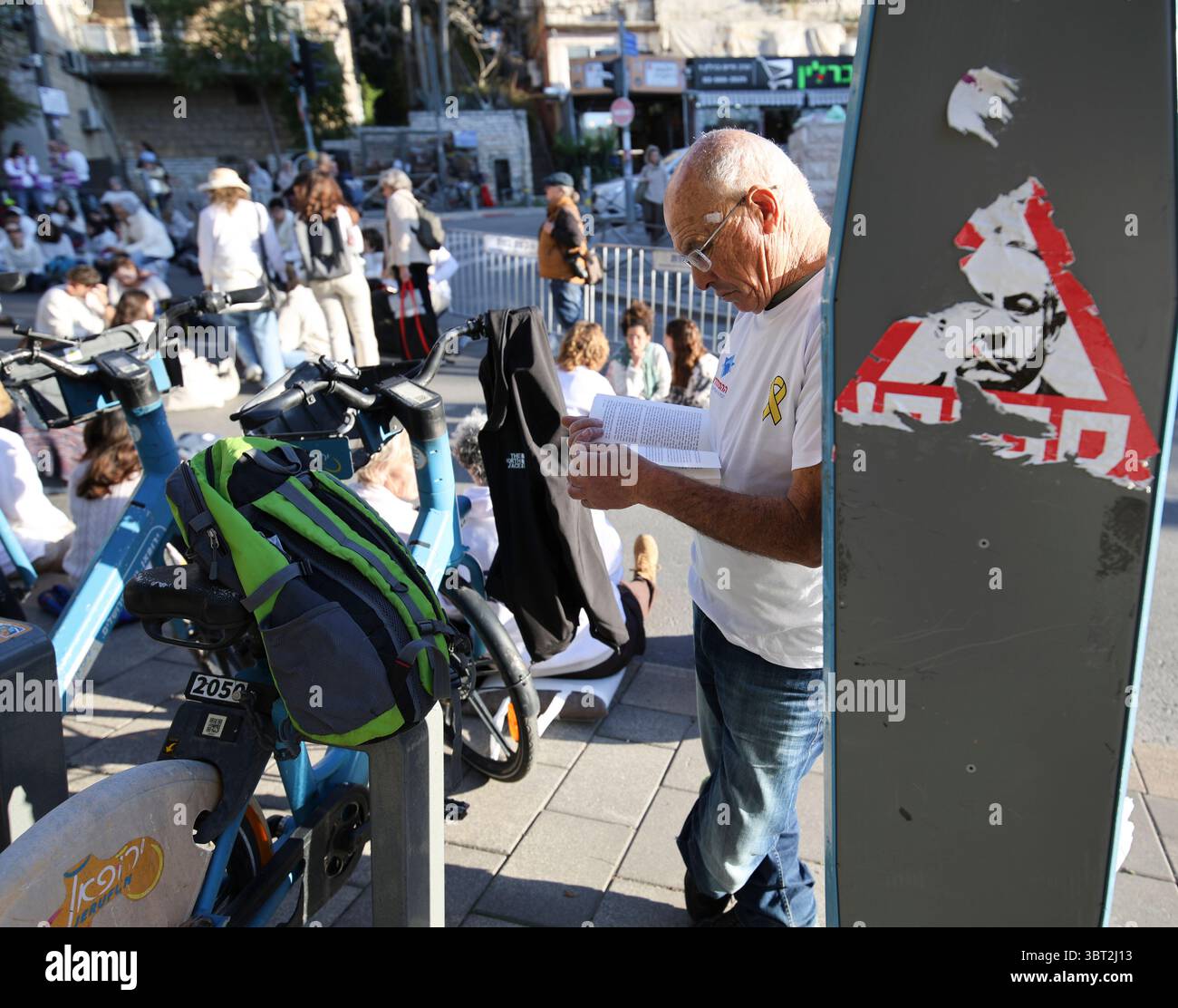 Silent protestors from the protest movement Shift 101 sit on the street ...
