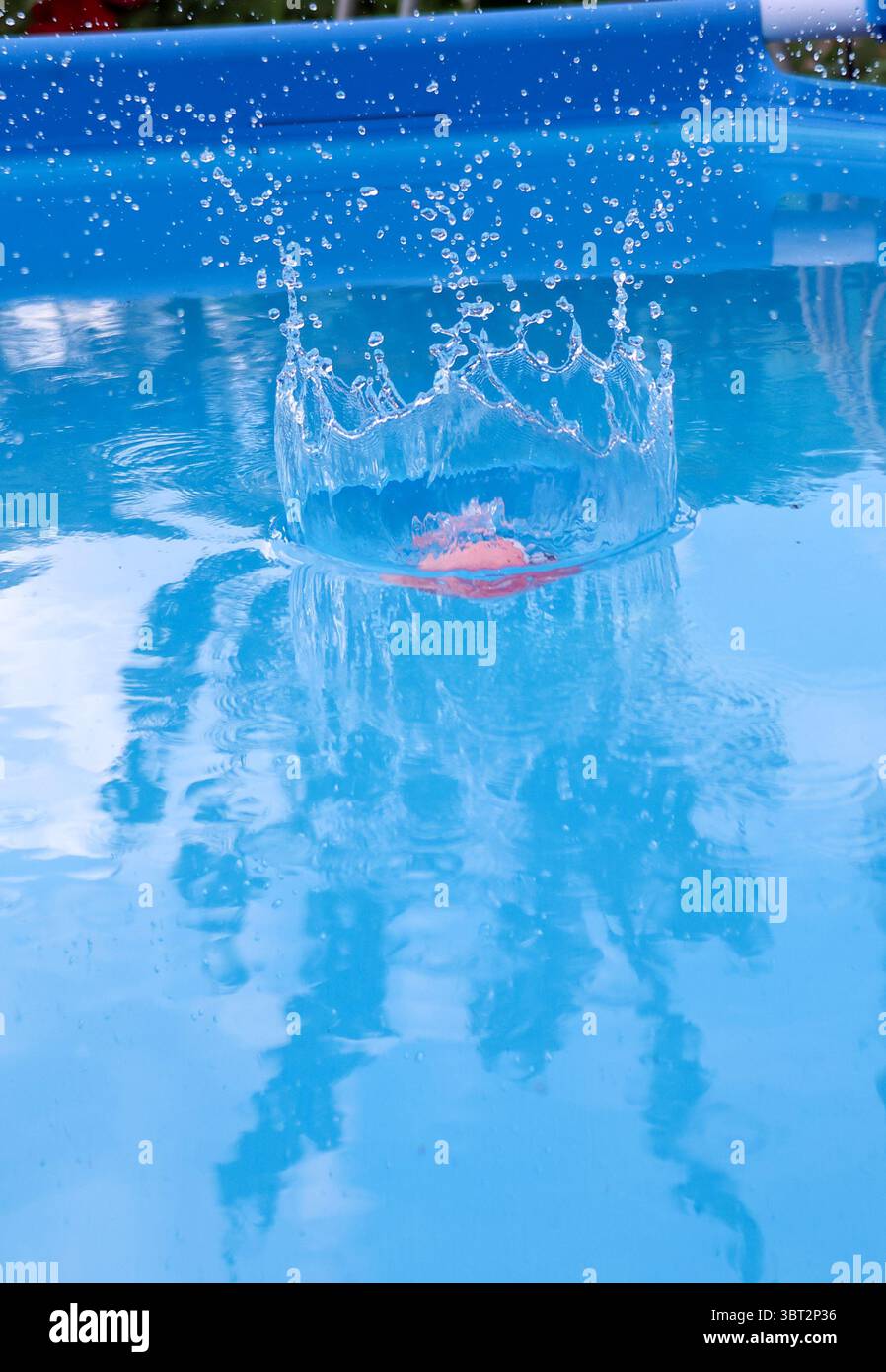 ball falling into the pool Stock Photo - Alamy