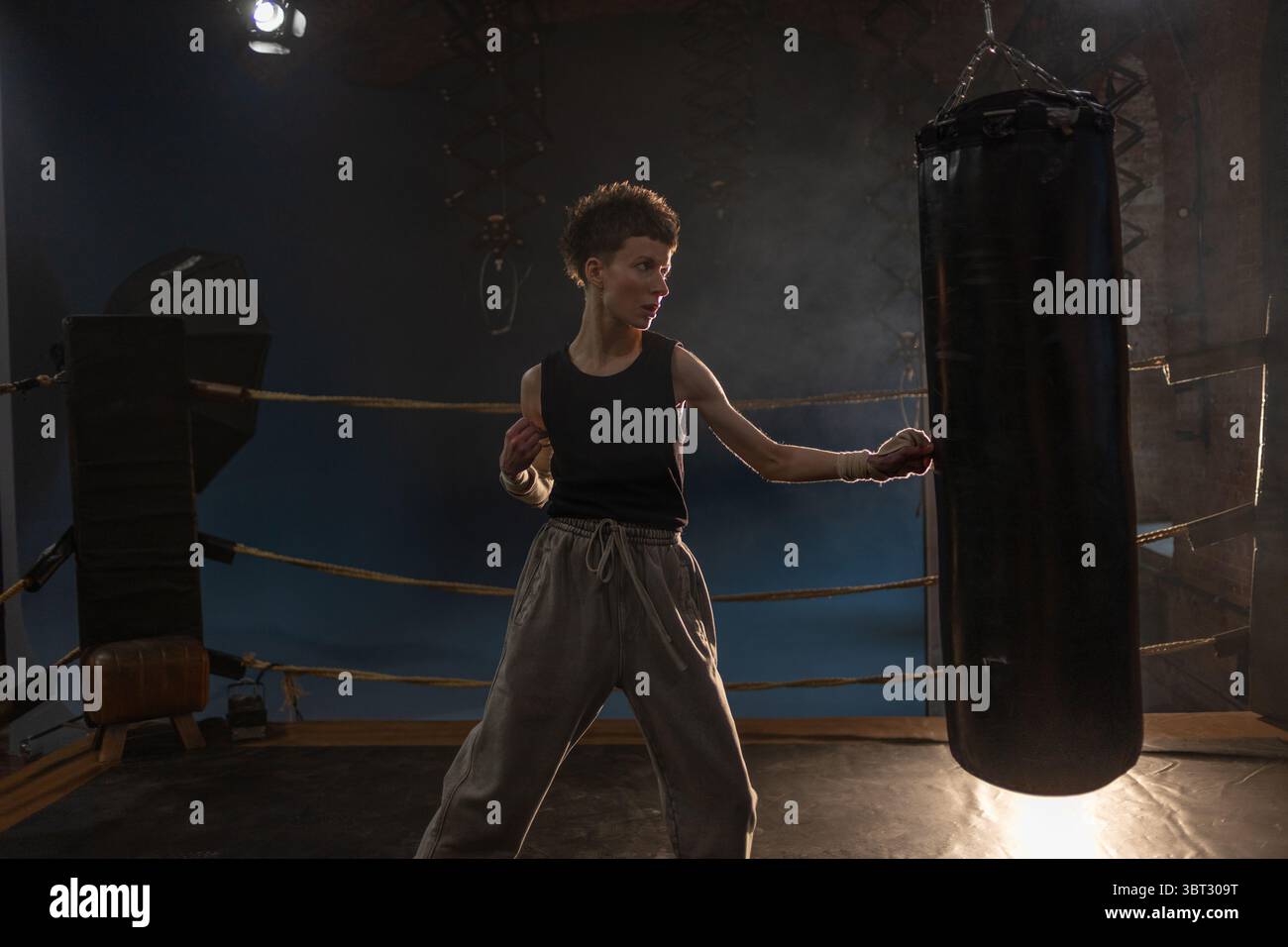 Boxing with a punching bag, sports achievements concept, female ...