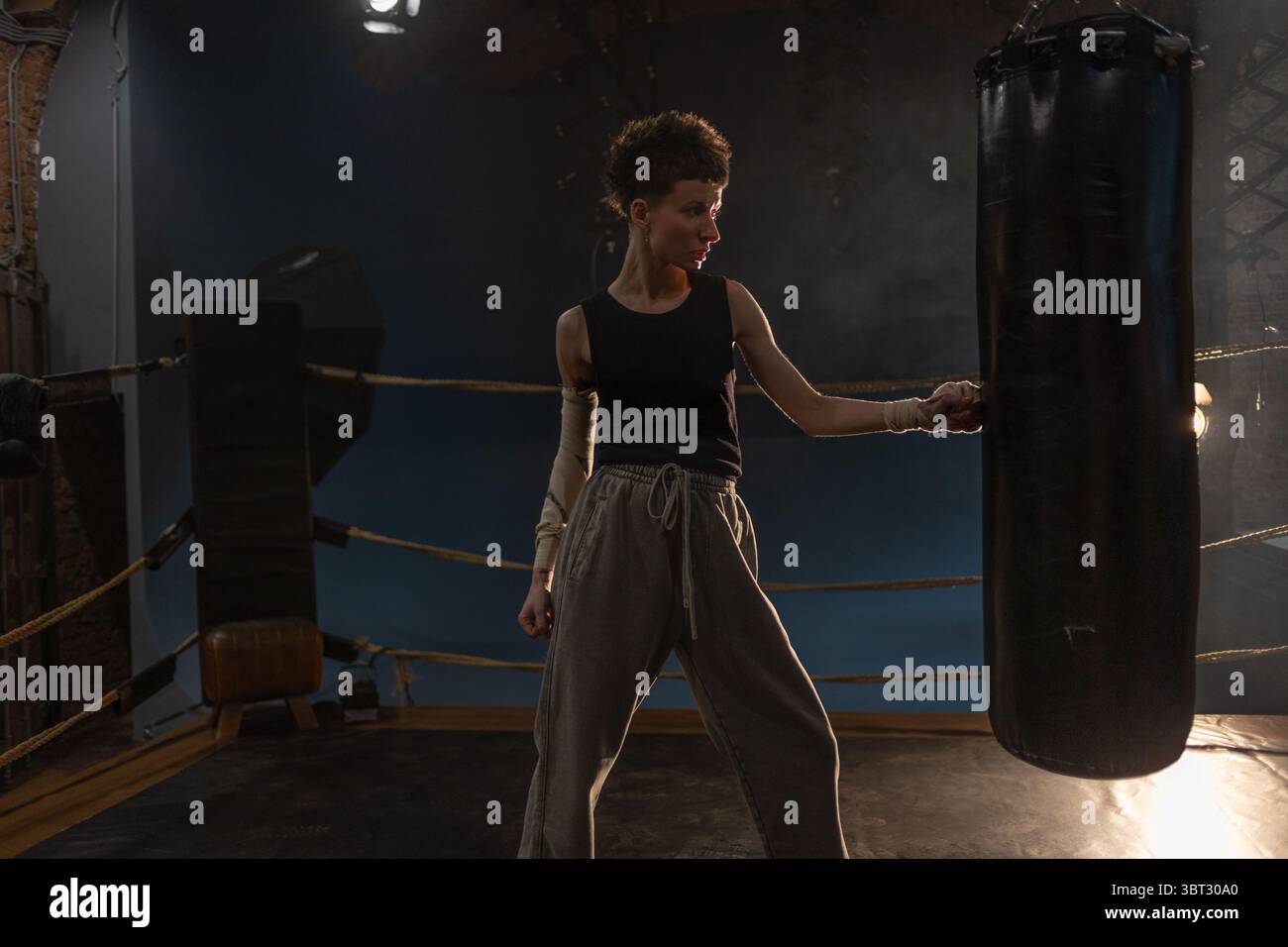 Boxing with a punching bag, sports achievements concept, female ...