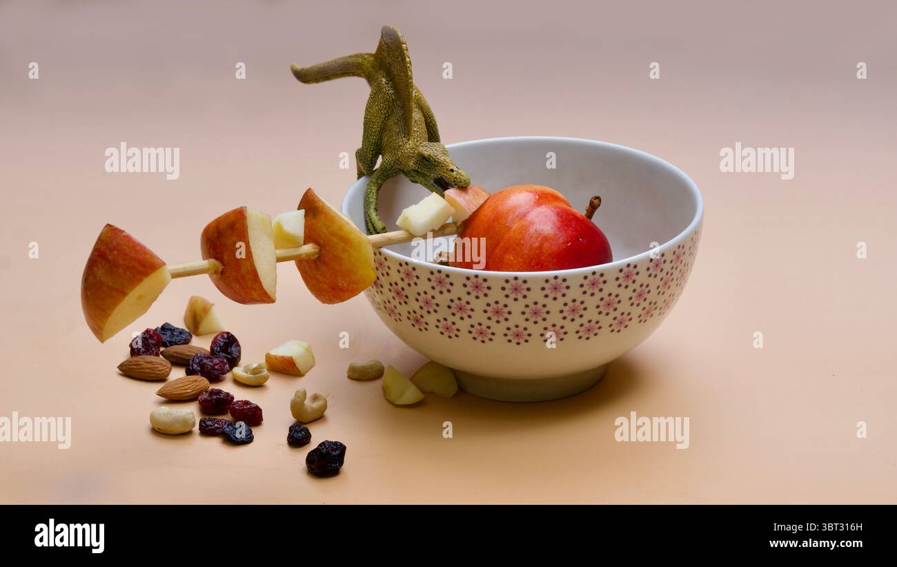 A toy dinosaur crawling into a muesli bowl with apples and a nectarine ...