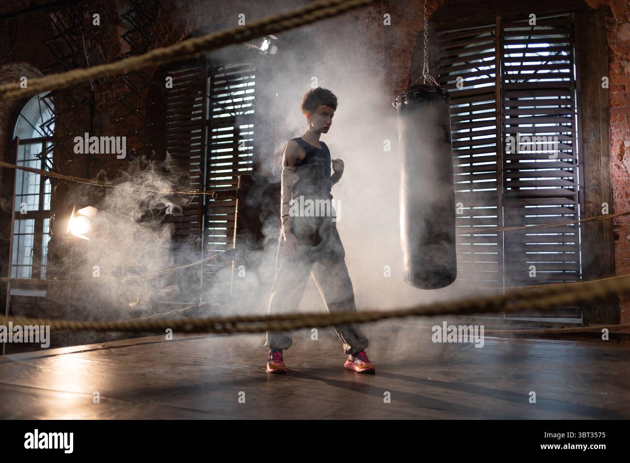 Boxing with a punching bag, sports achievements concept, female ...