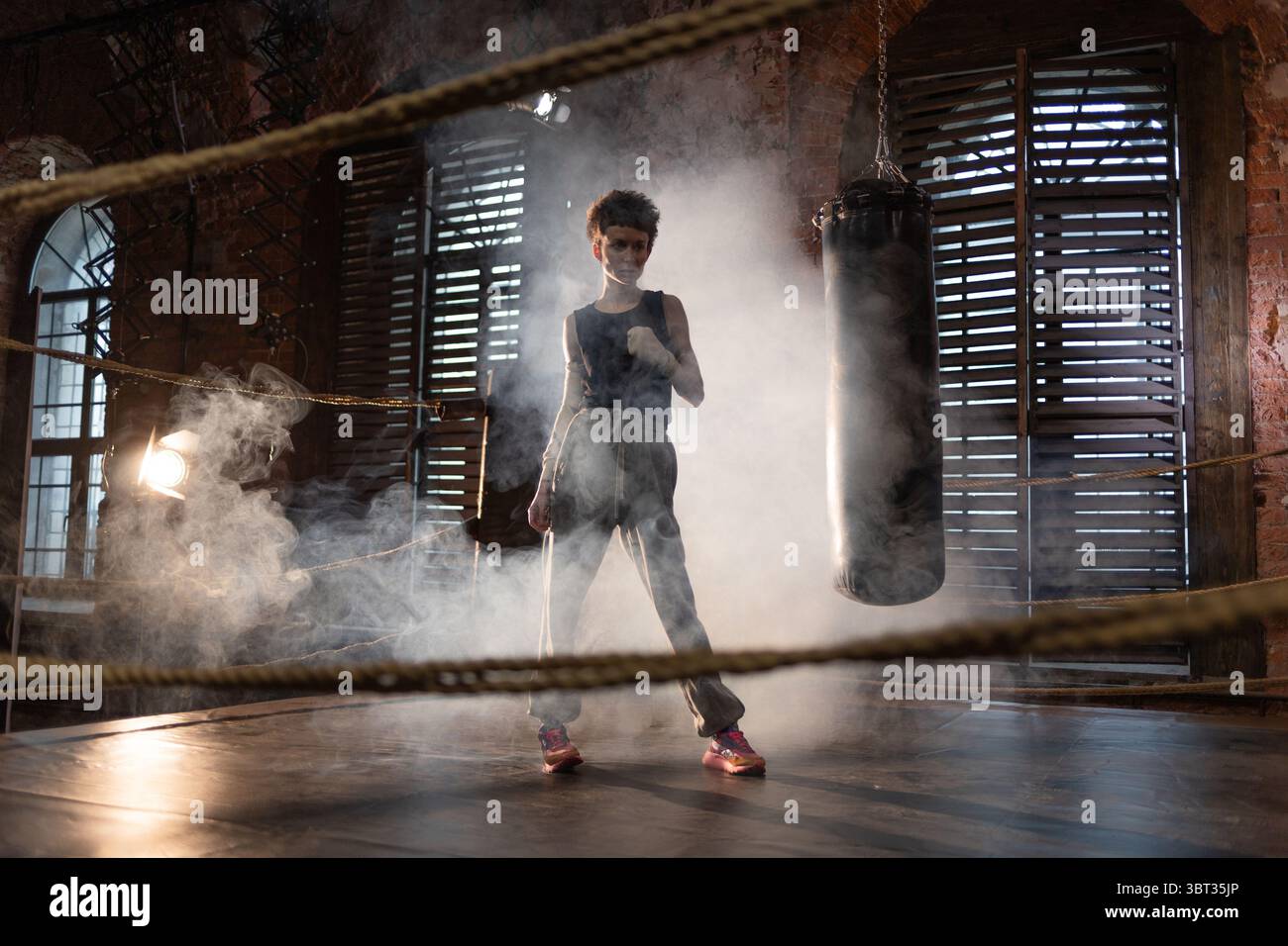 Boxing with a punching bag, sports achievements concept, female ...