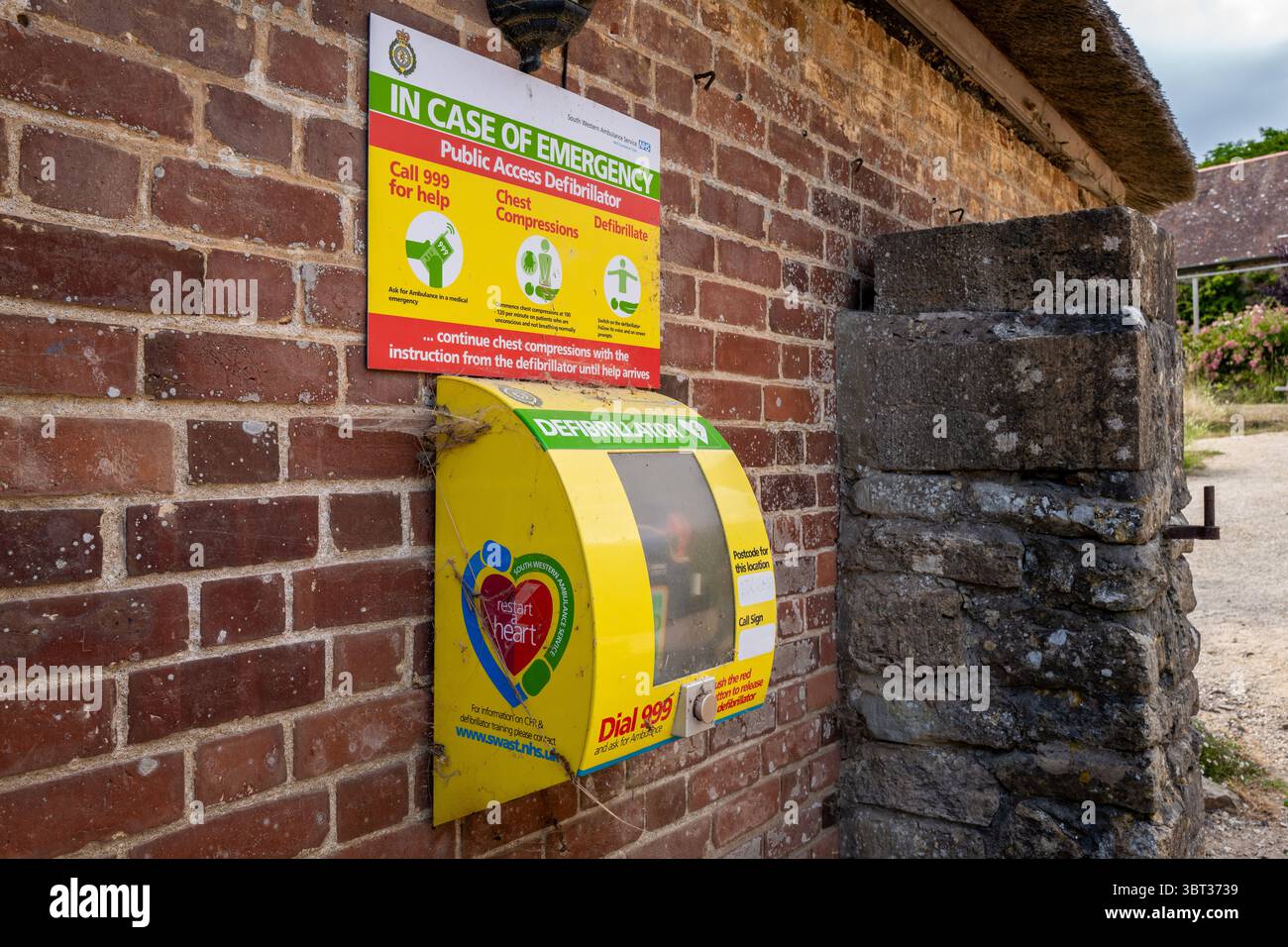 Public Access Defibrillator on Rustic Brick Wall in a rural Dorset ...
