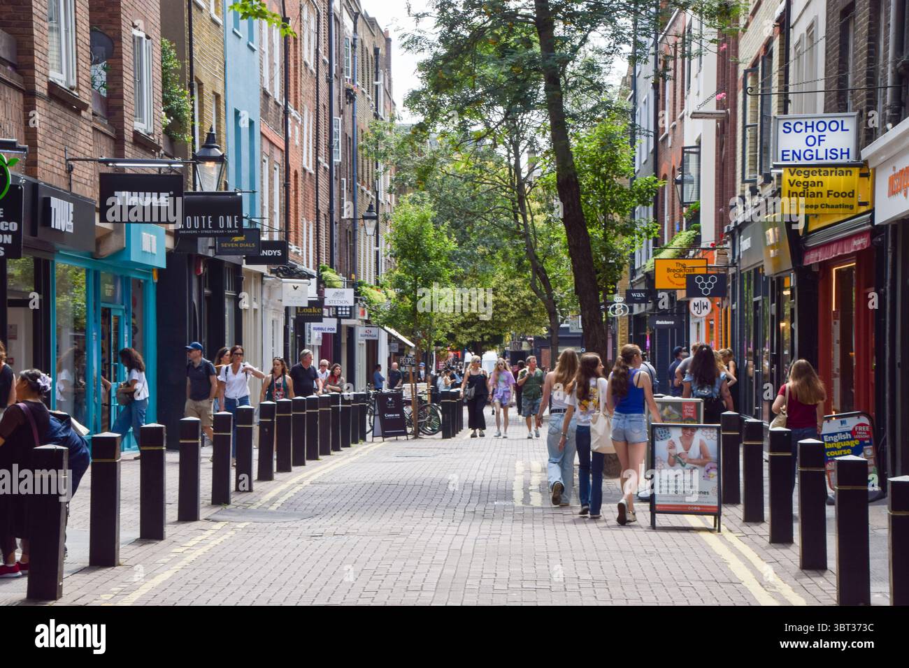 London, UK. 14th July 2025. People walk along Neal Street in Covent ...