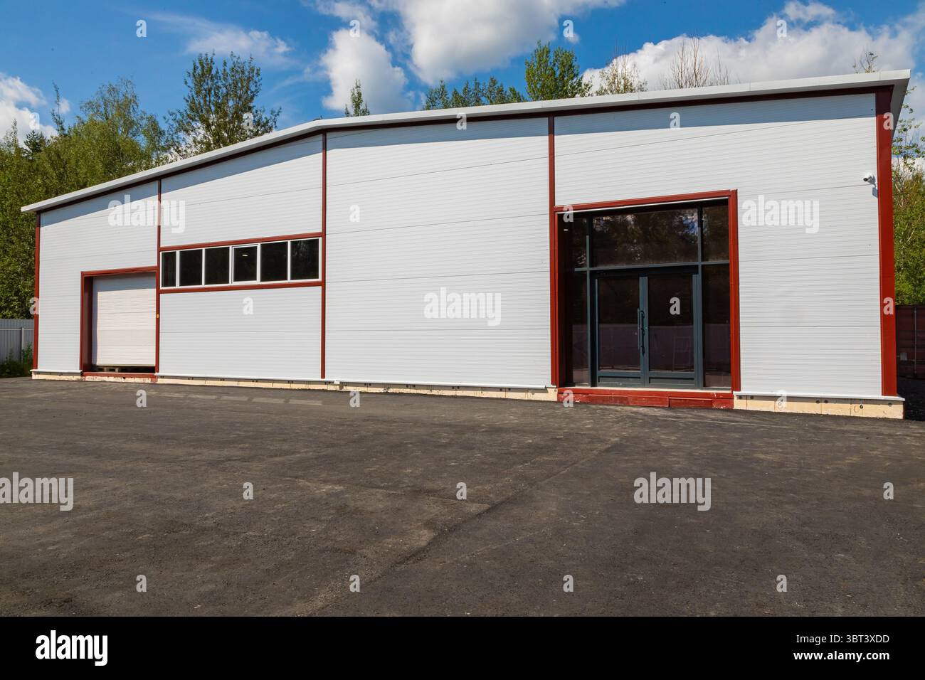 New commercial building featuring a large parking lot and loading dock ...