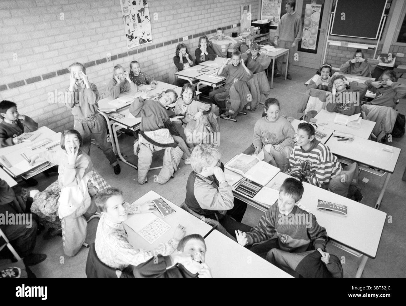 Bustling classroom scene filled hi-res stock photography and images - Alamy
