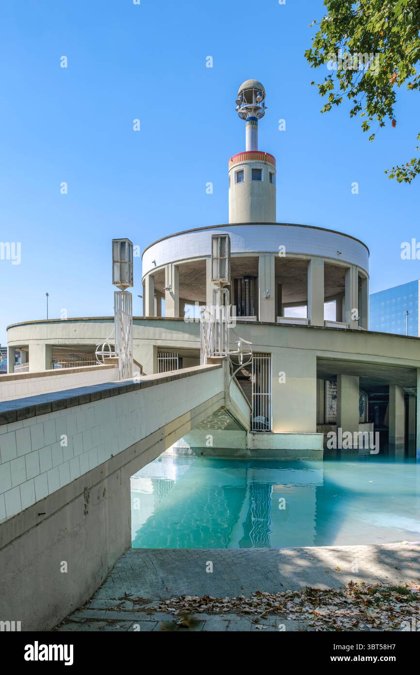Modern Circular Architecture With old insdustrial Tower And Water lake ...