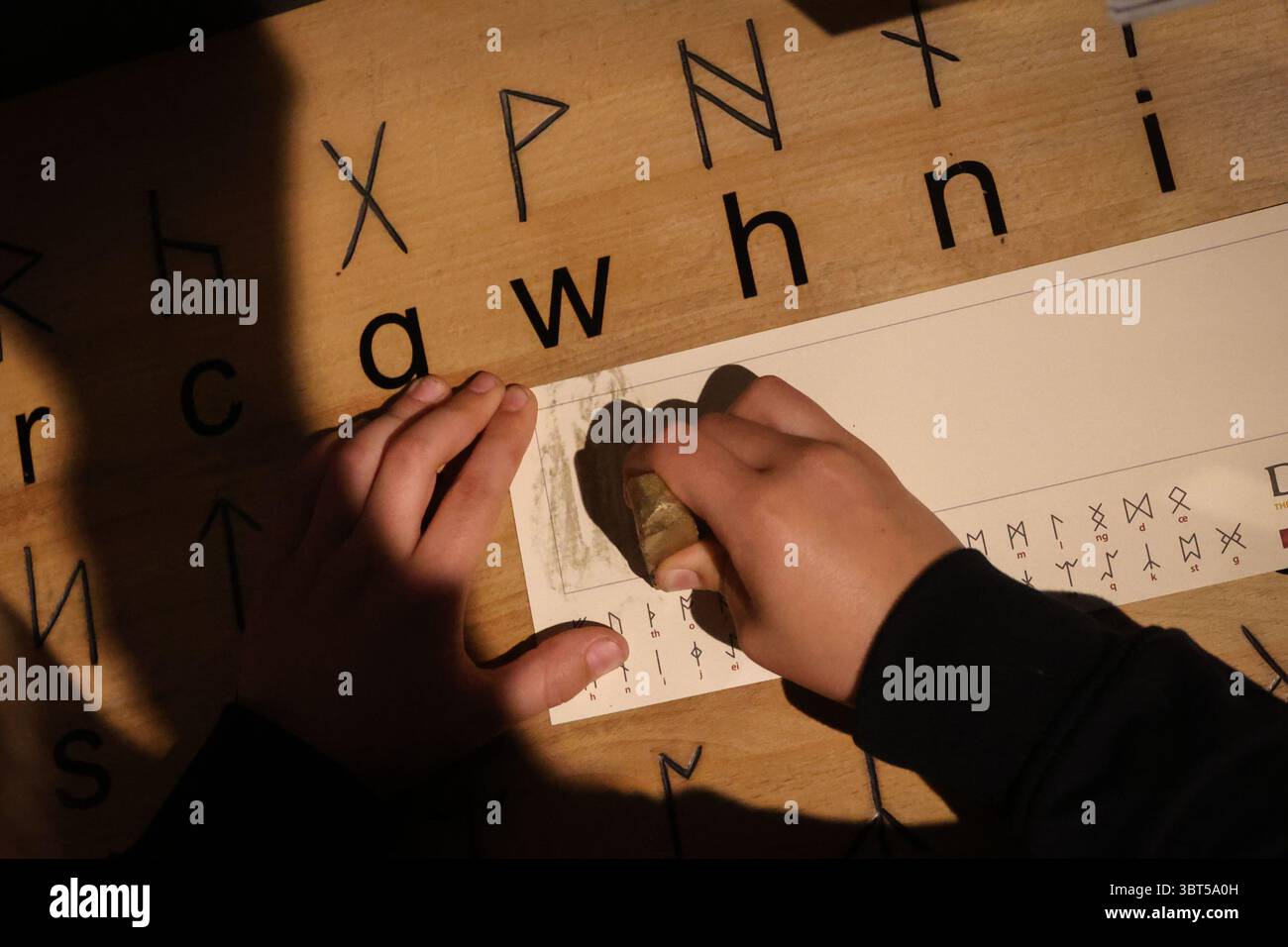 Hands writing on sheet of paper Stock Photo - Alamy