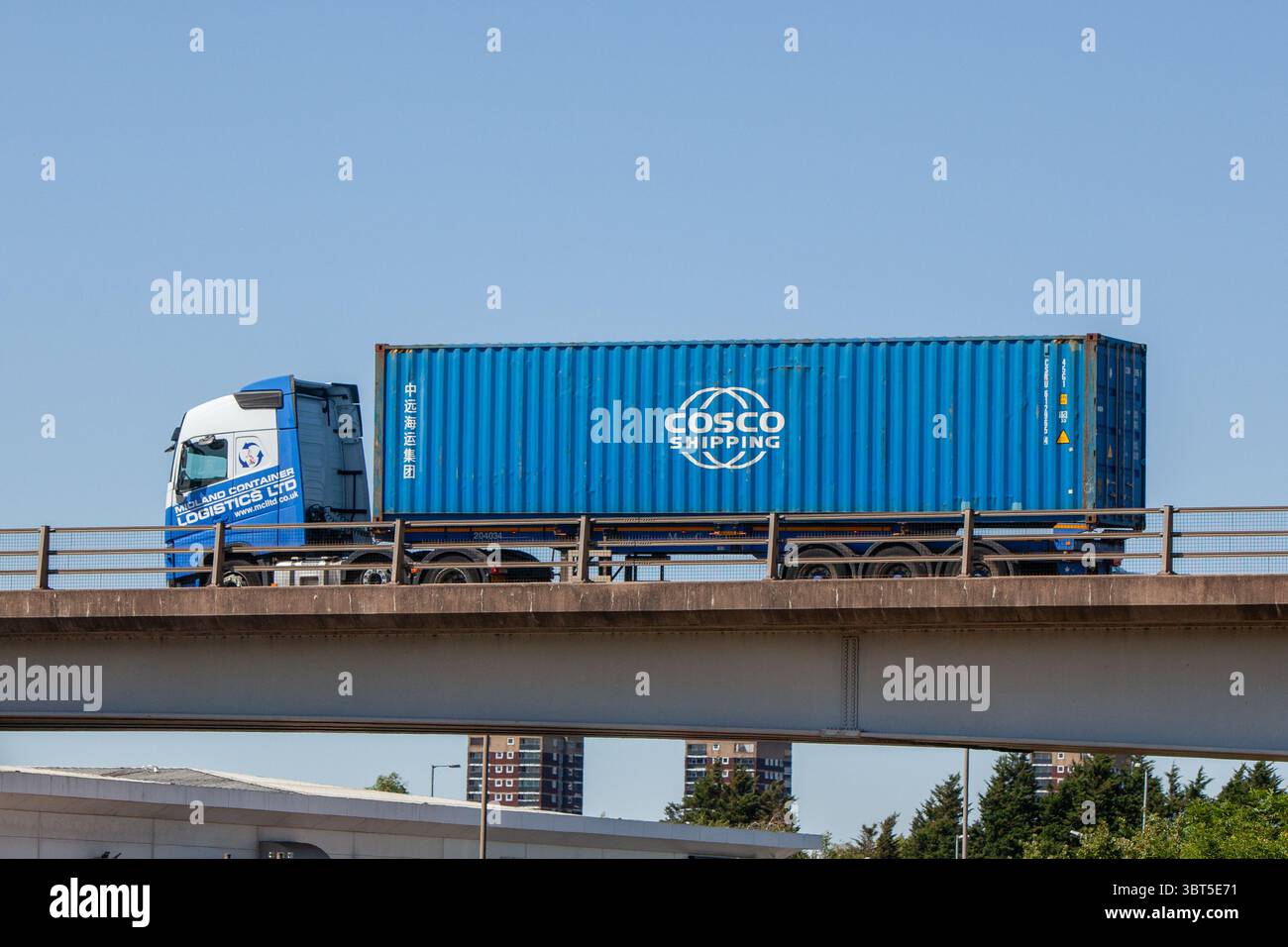 A Midland. Container Logistics Ltd articulated lorry with a blue Cosco ...