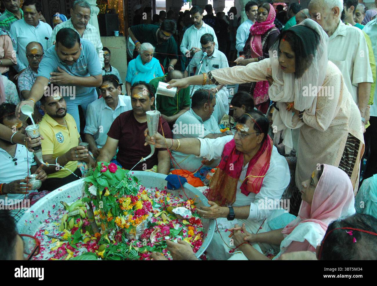 AMRITSAR, INDIA - JULY 14: Hindu devotees offer prayers to Hindu god ...