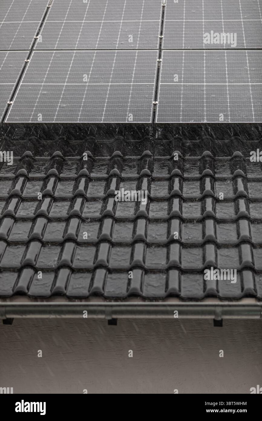 Heavy rain on roof tiles hi-res stock photography and images - Alamy