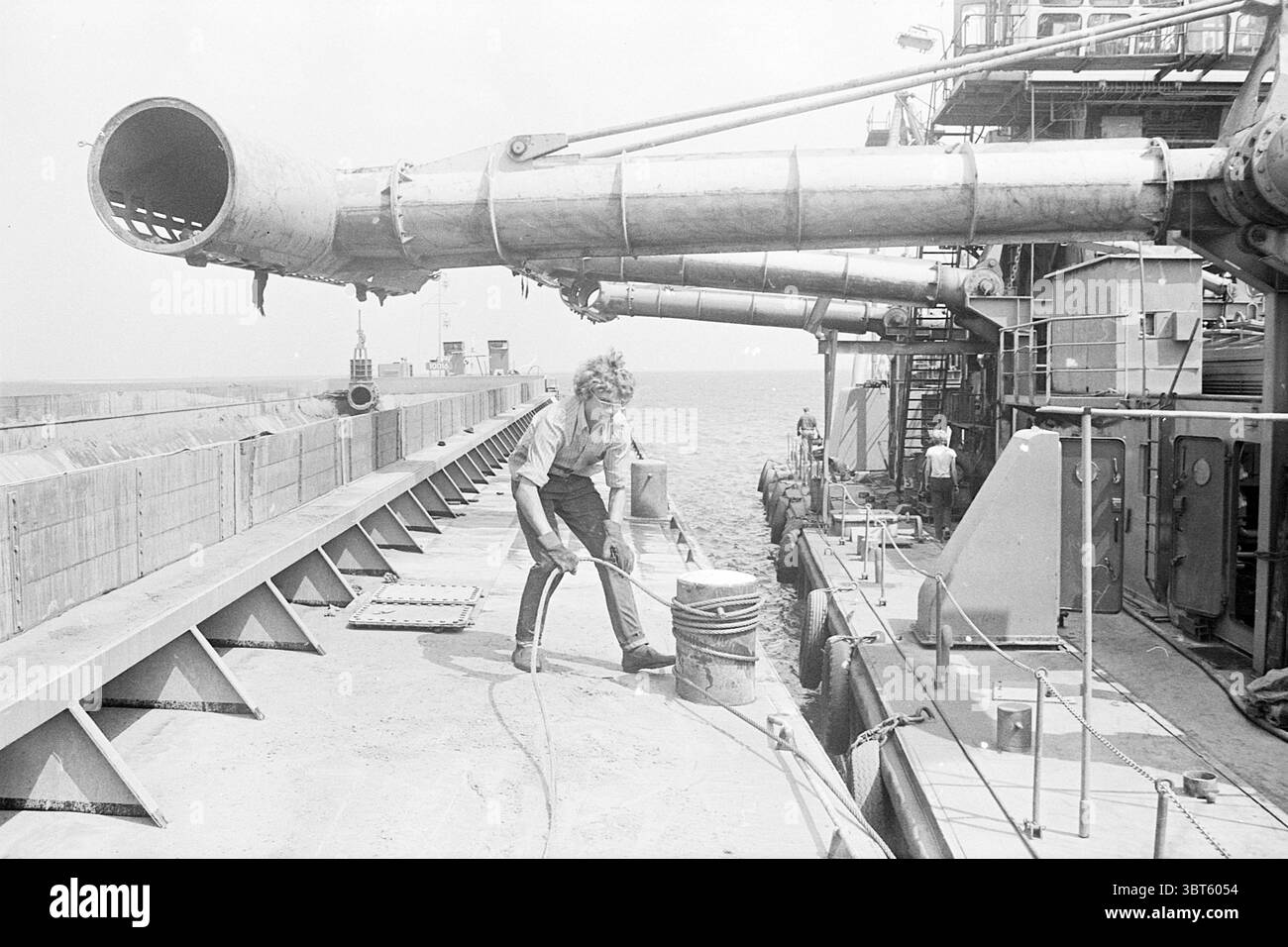 Massive industrial ship looms hi-res stock photography and images - Alamy