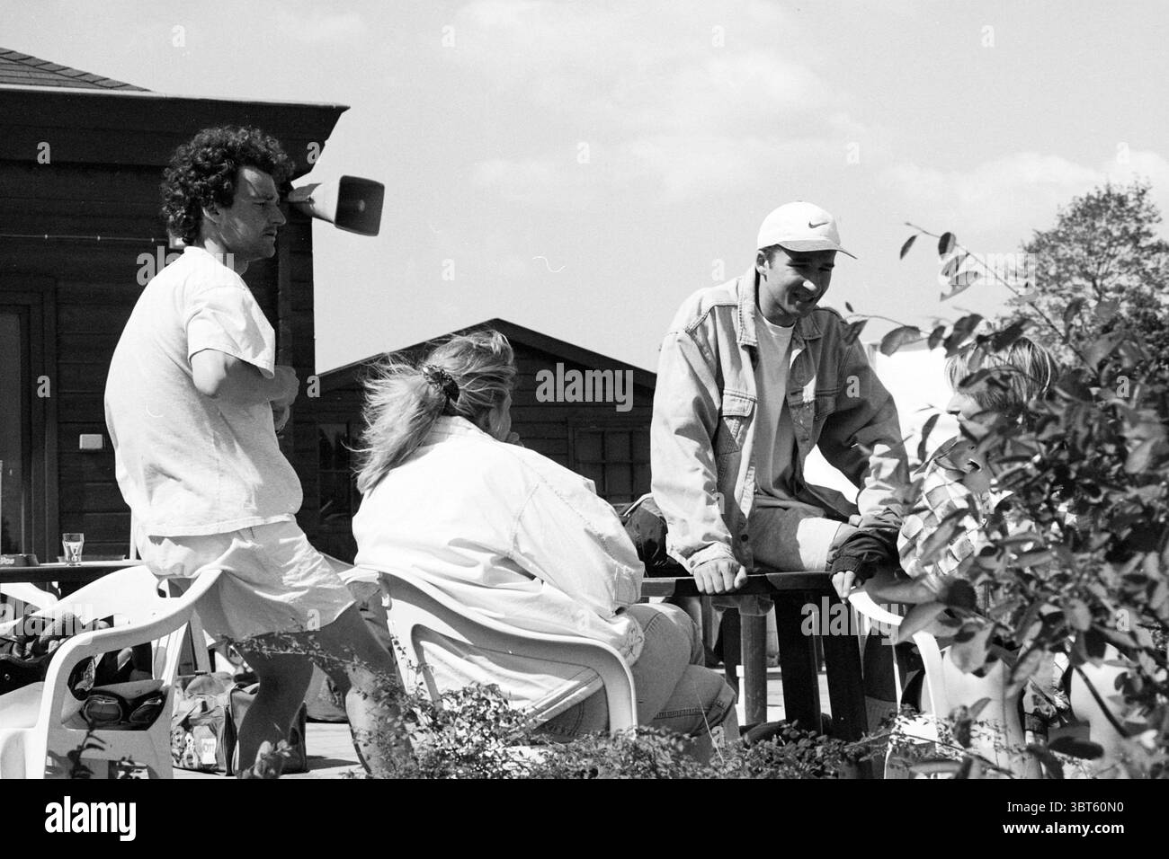 Seated man cap engages hi-res stock photography and images - Alamy