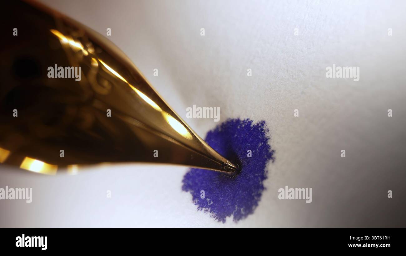 Macro of Blue Ink Flowing from Retro Fountain Pen Nib, Absorbing into ...