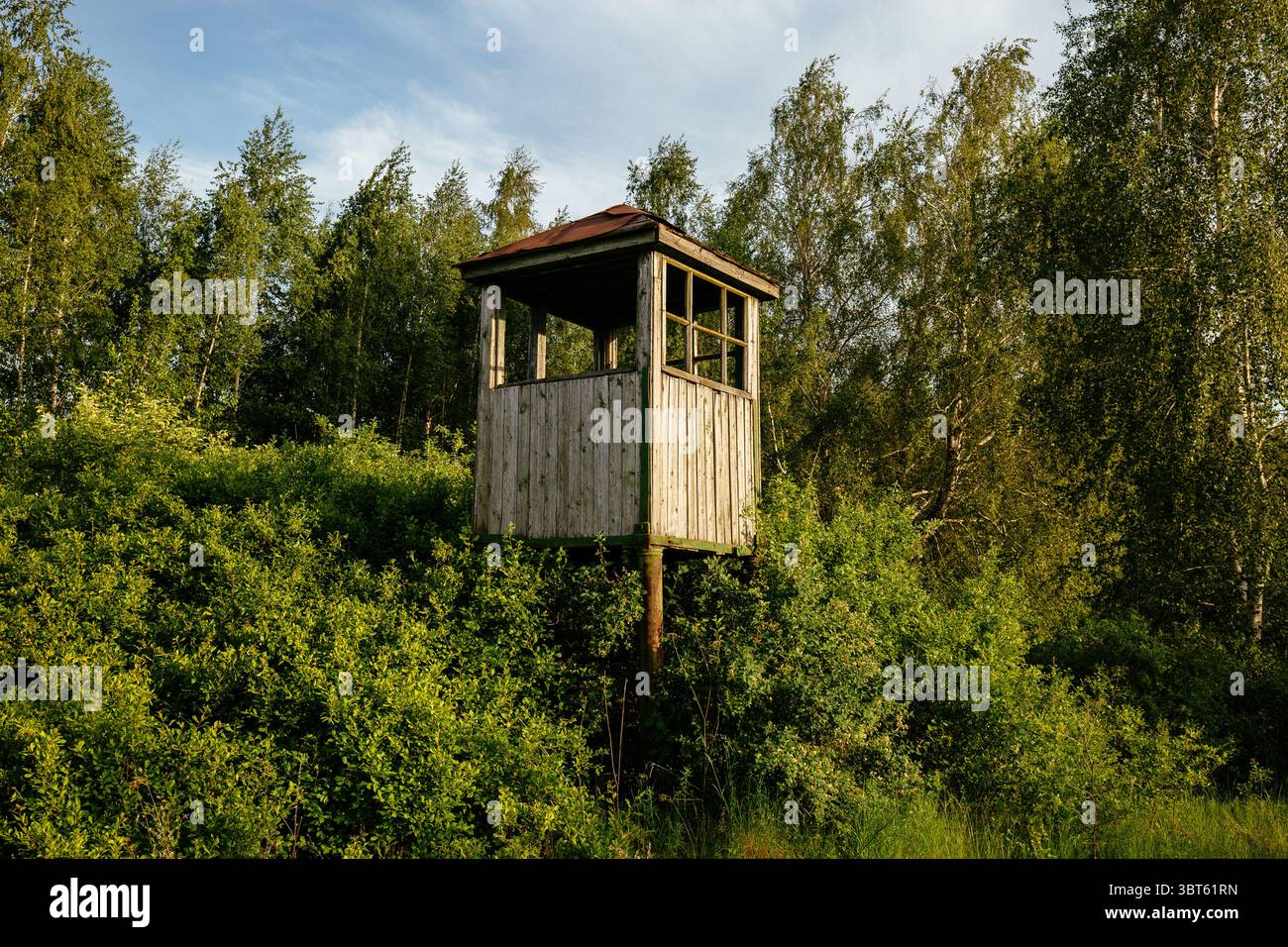 Old observation tower in abandoned overgrown Soviet Russian prison ...