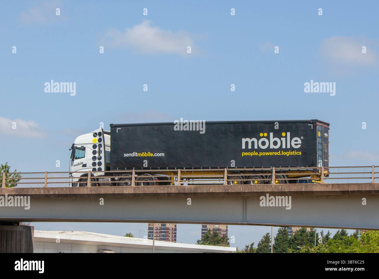 A MÖbile articulated lorry with a black curtain-sided trailer on the A5 ...