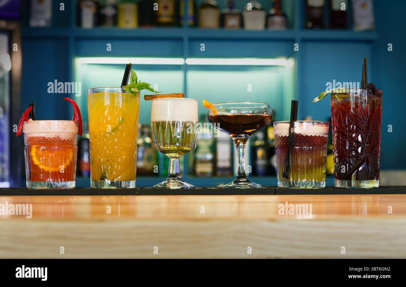 Creative alcohol cocktails in night club bar Stock Photo - Alamy